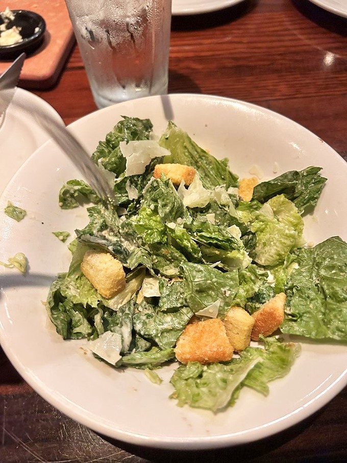 Even the Caesar salad gets respect here&mdash;crisp romaine, shaved parmesan, and house-made croutons that weren't born in a bag. A nod to those seeking green.