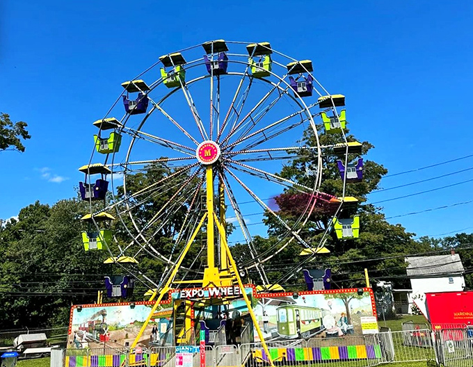 The Chester Fair's Ferris wheel against a Connecticut blue sky &ndash; proof that simple pleasures never go out of style, especially when bathed in sunshine.