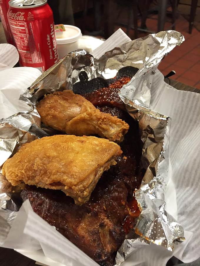 Fried chicken and ribs sharing the spotlight in aluminum foil &ndash; a partnership more harmonious than most Hollywood marriages.