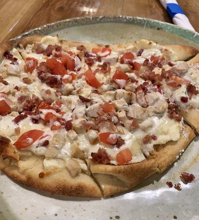 The chicken bacon ranch flatbread delivers that perfect trifecta of flavors that somehow makes you feel like you're eating something sophisticated while satisfying your inner teenager. 