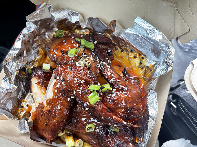 These aren't just wings; they're sticky, glistening flavor bombs that render napkins useless and make finger-licking socially acceptable again.