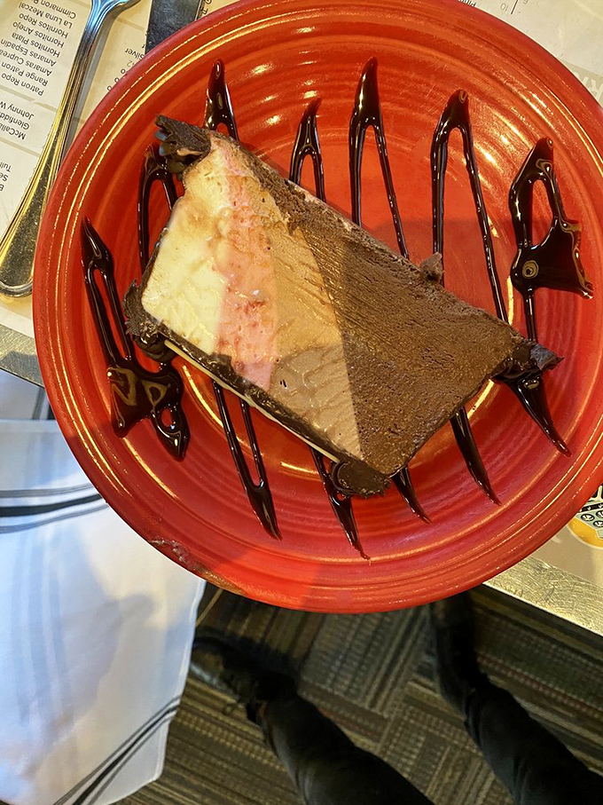 Layer upon layer of chocolate decadence drizzled with sauce&mdash;a dessert that doesn't just end a meal, but creates a grand finale.