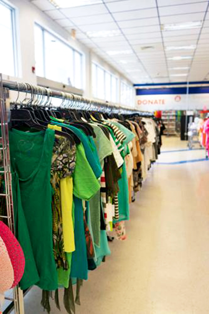 A forest of fashion possibilities where every hanger holds potential. The thrill of the hunt keeps shoppers scanning each rack with eagle eyes.