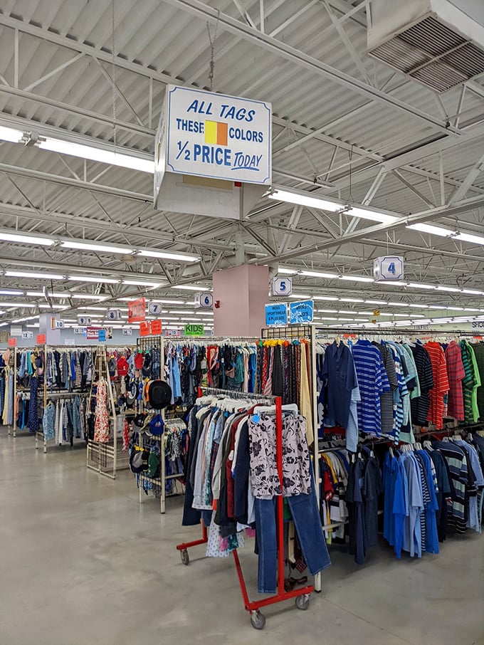 The half-price rainbow appears like a retail mirage—drawing shoppers toward the promise of even greater savings in this bargain bazaar.