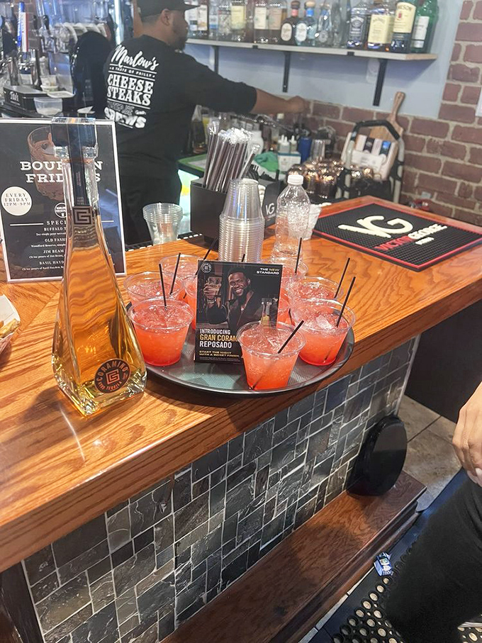 These cocktails aren't just drinks&mdash;they're liquid accessories for your cheesesteak adventure. That vibrant red says "weekend" in any language.