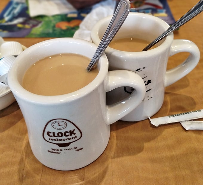 Coffee mugs emblazoned with the Clock logo &ndash; sturdy enough to withstand endless refills and early morning conversations about everything and nothing.