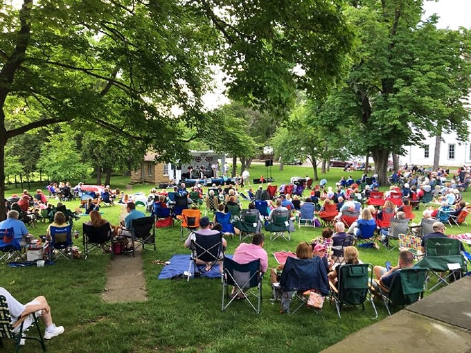Summer concerts under ancient trees draw crowds with lawn chairs and picnic baskets &ndash; small-town entertainment at its finest.