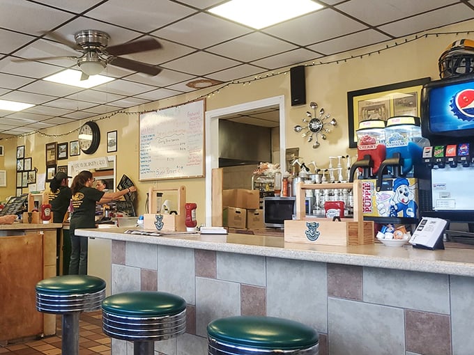 Behind this counter, breakfast magic happens with the efficiency of a NASCAR pit crew and the warmth of a family kitchen.