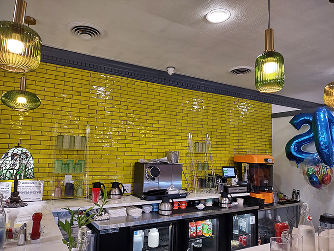 Behind that brilliant yellow tile backsplash, breakfast magic happens&mdash;the coffee station standing ready like morning's command center. 