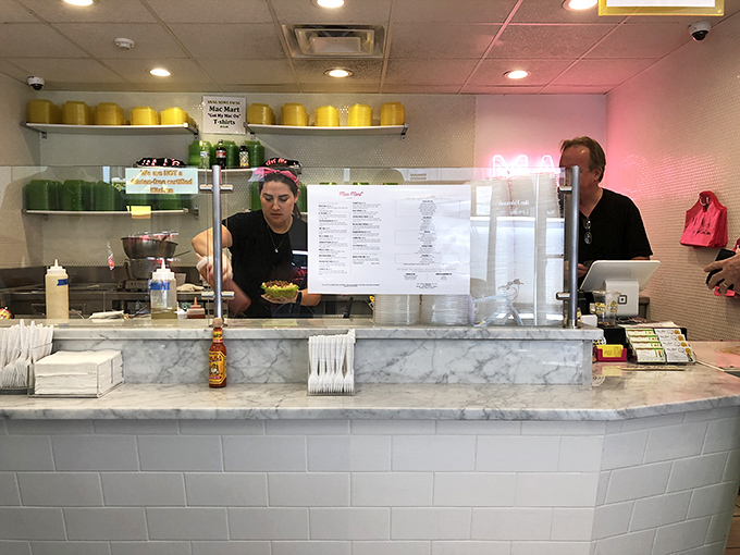 Behind this marble counter, cheese wizards transform simple ingredients into bowls of pure, unadulterated joy.
