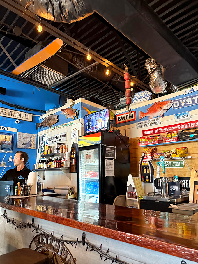 The counter where seafood dreams come true. Those mounted fish on the walls aren't just decoration &ndash; they're inspiration for what might end up on your plate. 