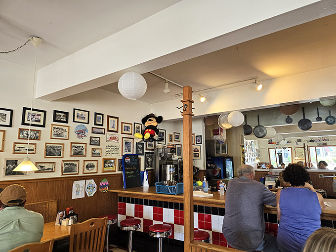 Vintage photos line the walls while Mickey keeps watch over the counter, where regulars claim their usual spots like homesteaders staking territory.