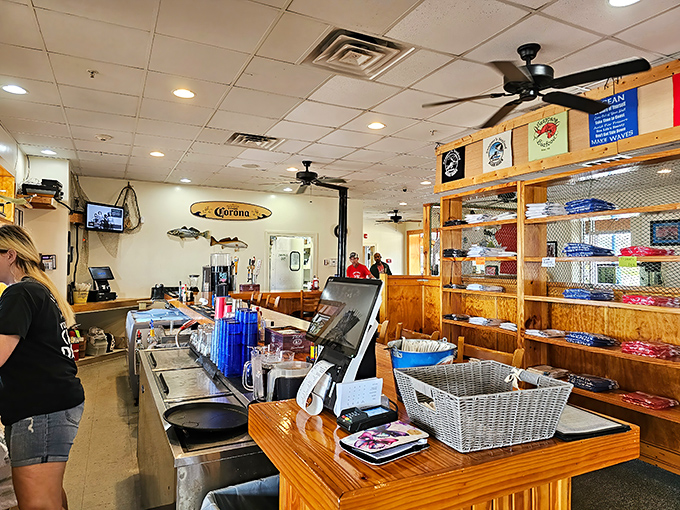 Behind every great seafood joint is a counter where magic happens. The Corona surfboard isn't just decoration&mdash;it's a lifestyle statement.