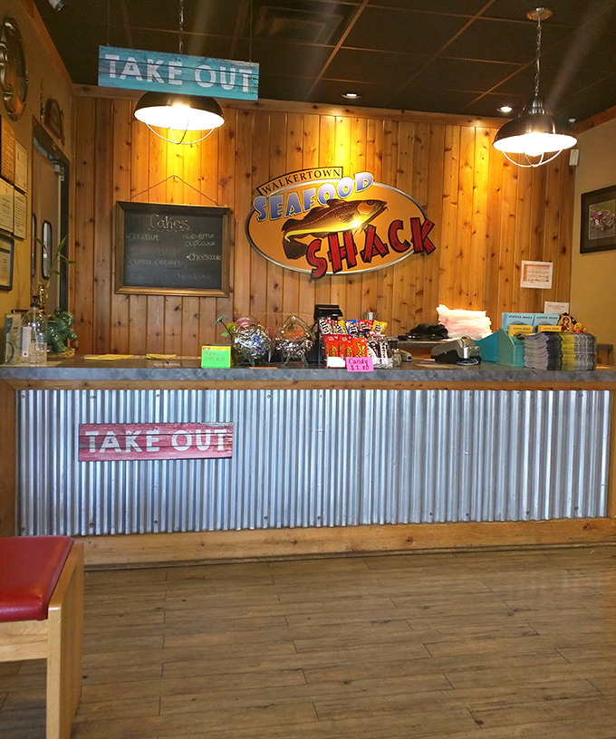 The take-out counter where seafood dreams come true, complete with that classic corrugated metal that says "the food here means business."