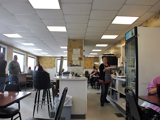 The heart of operations, where orders are called out in diner shorthand and coffee cups never stay empty for long.