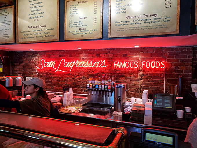 The neon sign glows like a beacon for the sandwich-starved masses. Behind that counter, sandwich artists perform their daily magic.