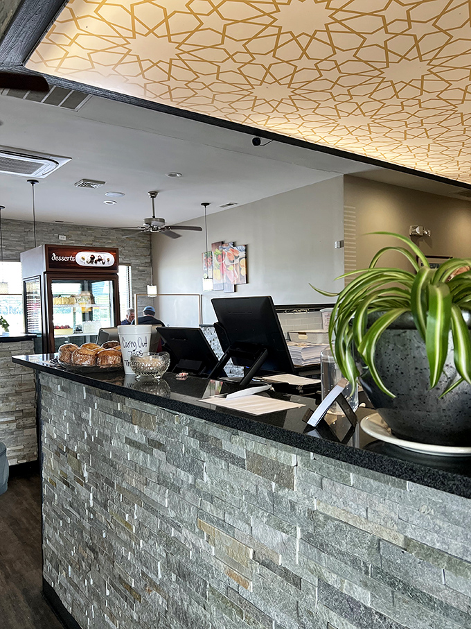 The host station doubles as dessert display central&mdash;strategic placement that ensures you'll never leave without considering something sweet for the road.