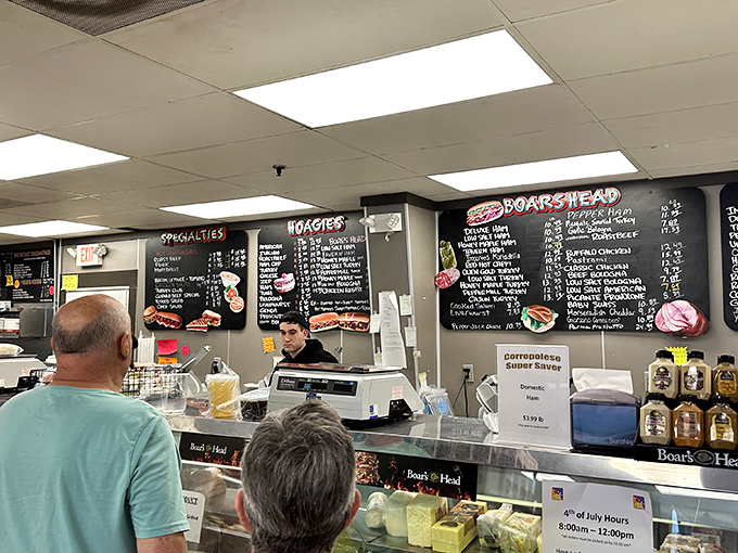 At the counter, where sandwich magic happens, customers wait with the patience of people who know that greatness can't be rushed.