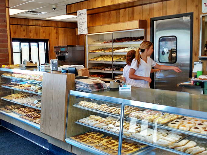 Behind this counter, magic happens daily. The donut-to-pizza transition is seamless, like Clark Kent becoming Superman but tastier.