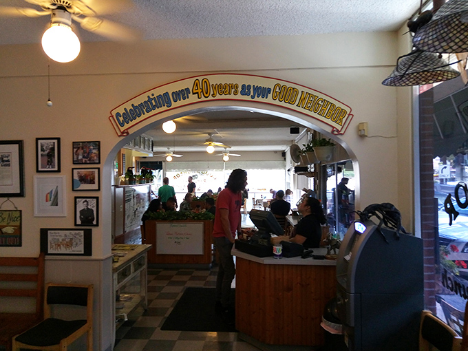 Forty years of serving as the neighborhood's morning headquarters, proudly announced above the archway like a badge of delicious honor.