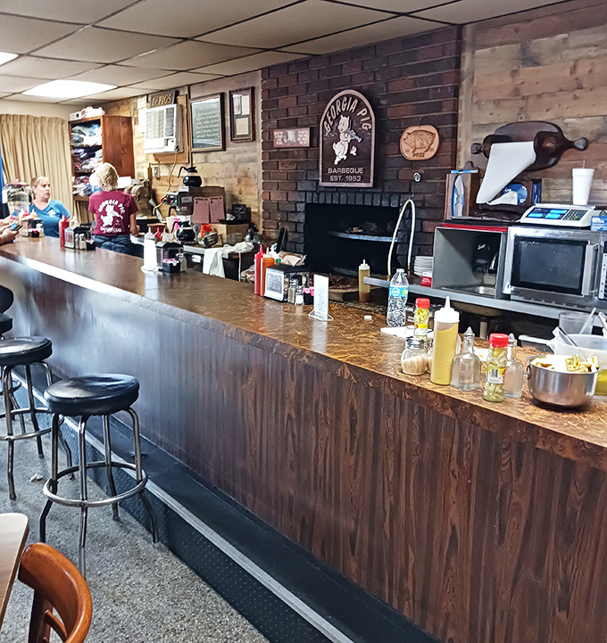The counter where barbecue dreams come true, condiment bottles standing at attention like soldiers guarding flavor treasures.