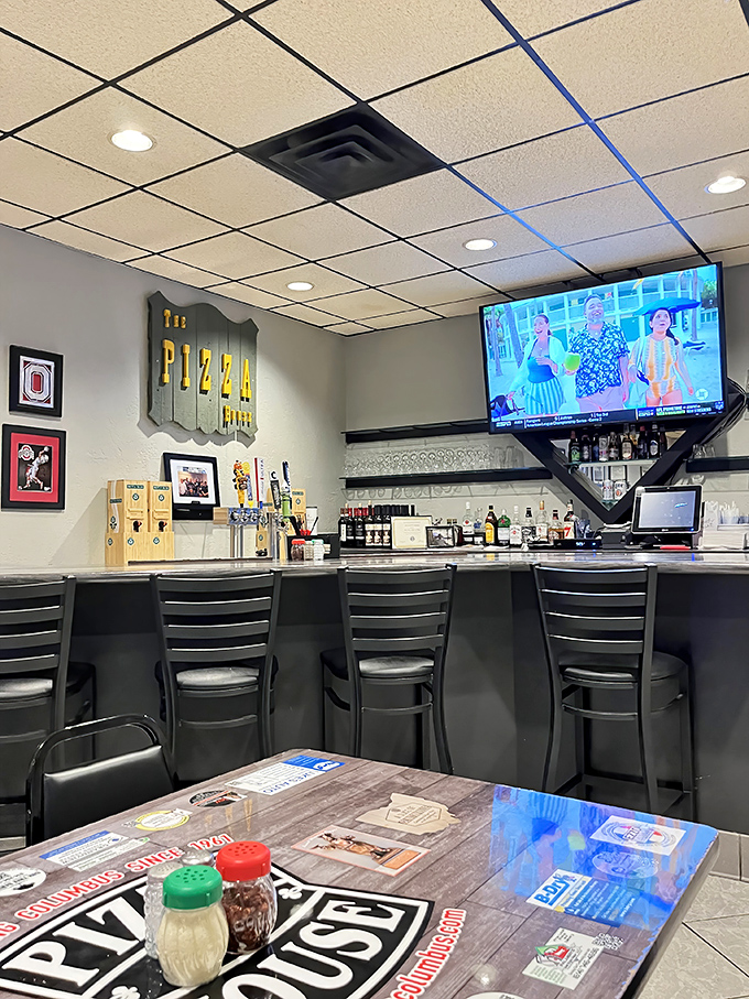 The perfect perch for solo diners or friendly chatter—bar seating where you can watch sports, sip a beer, and become part of the Pizza House family.