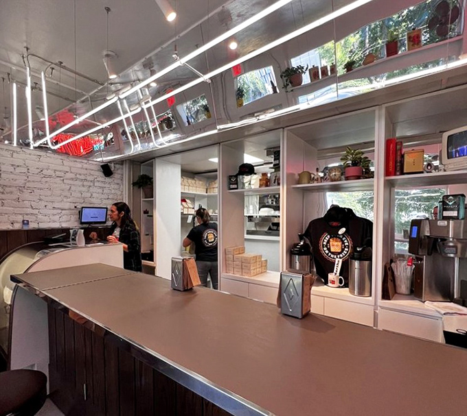 Breakfast theater in full swing&mdash;white brick walls, wood paneling, and staff moving with the choreographed precision of breakfast ballet performers.