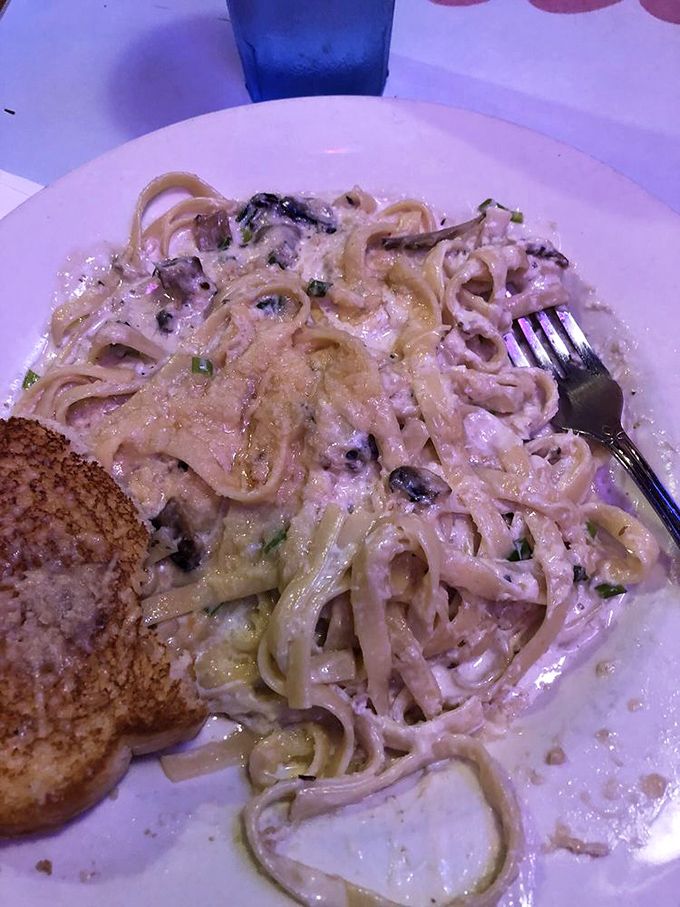 Pasta swimming in a creamy sea of alfredo sauce, studded with treasures from the deep. Carb heaven with a coastal twist.