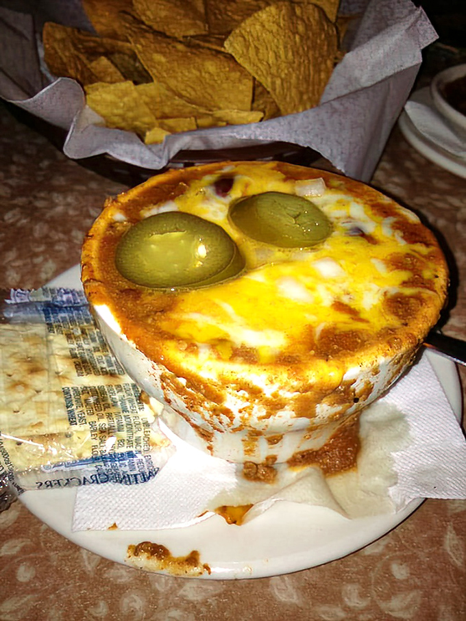 Those green olives peeking out from melted cheese like they're playing hide-and-seek&mdash;a savory surprise in every spoonful.