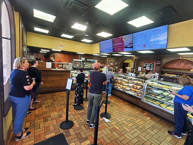 The line forms to the right, but moves with purpose. Like pilgrims at a sacred site, these customers know that patience yields delicious rewards.