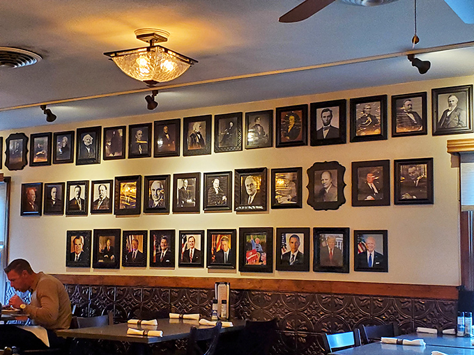 Presidential portraits line the walls like silent dinner companions, creating an atmosphere that's equal parts history lesson and homey dining room.