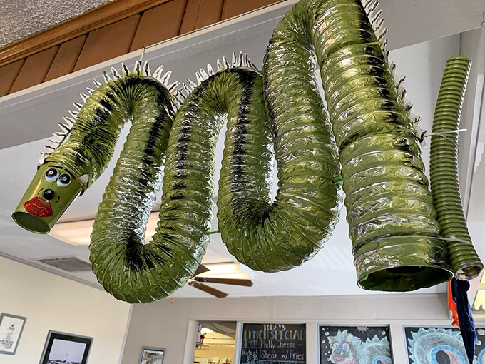 Who says ventilation ducts can't be fun? This whimsical green dragon watching over diners proves that imagination tastes just as good as breakfast.