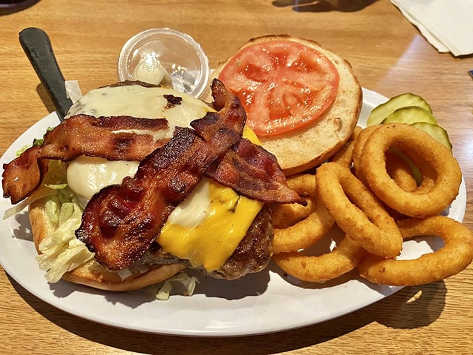When a burger comes dressed with this much bacon and cheese, it's not just lunch &ndash; it's a commitment to excellence.