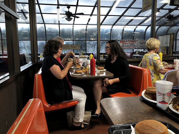 The sunlit dining area with its classic booths isn't just a place to eat&mdash;it's where strangers become friends over shared appreciation of comfort food.