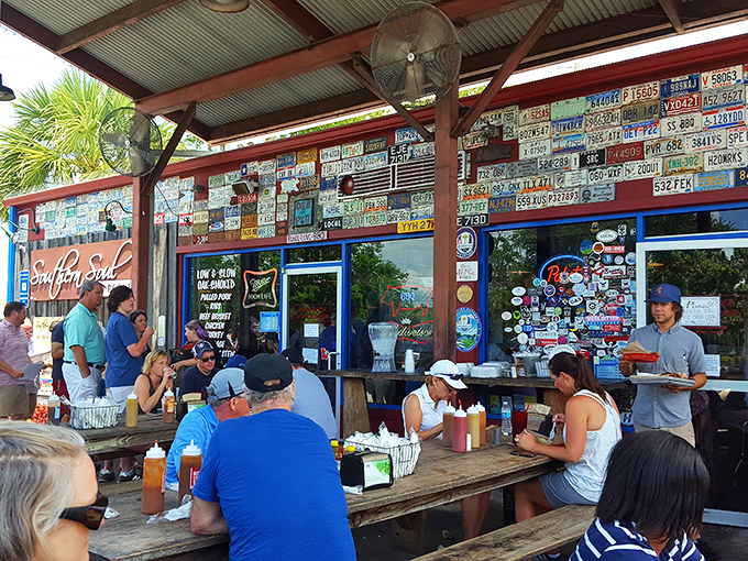 The outdoor dining scene—where strangers become friends over shared BBQ enthusiasm and sauce-stained napkins. No one's checking their watch here.