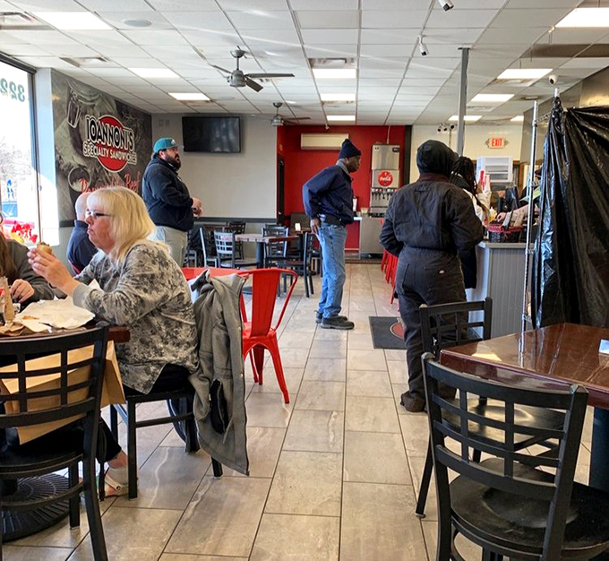 A cross-section of humanity united by one common goal: getting their hands on sandwiches worth standing in line for.