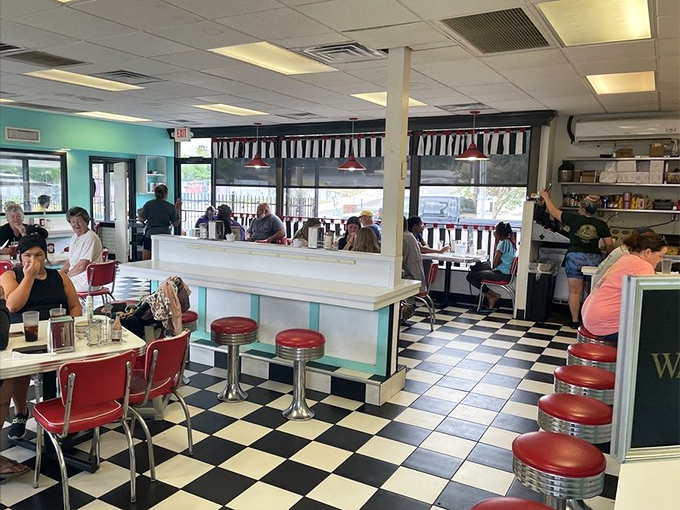 Every seat tells a story at Louie's. The multigenerational crowd proves that good taste transcends age brackets.