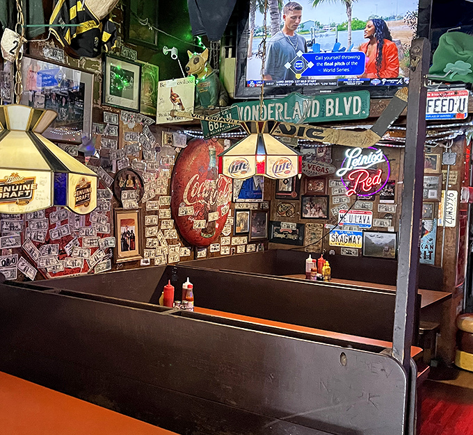 Every inch of wall space tells a story at Thurman's, where dollar bills and memorabilia create a museum of good times past.