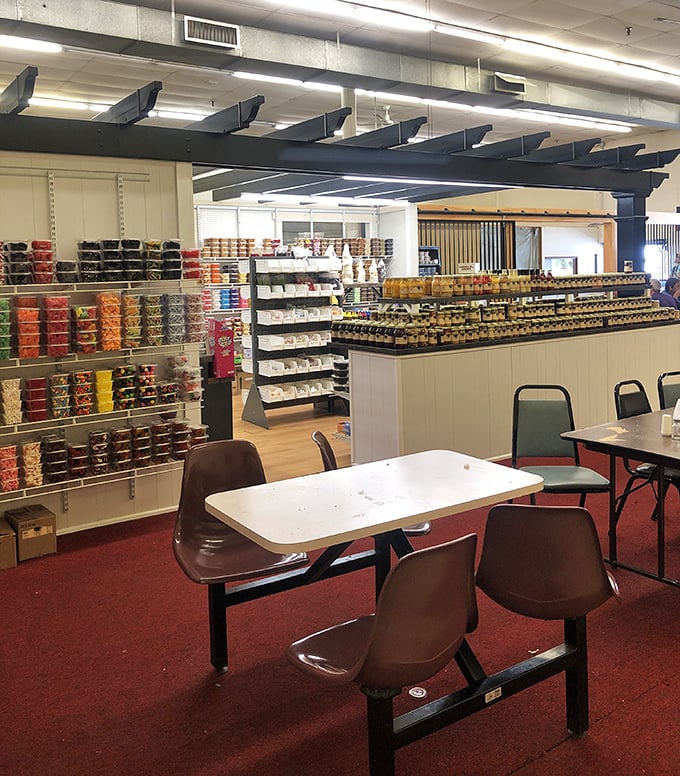 The market's dining area offers a moment of respite, where tired feet rest and shoppers debate the merits of potential purchases.