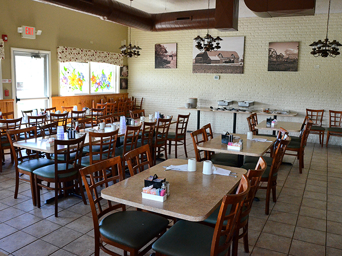 The dining room where conversations flow as freely as the coffee. Those farm photos on white brick walls remind you exactly where your food comes from.