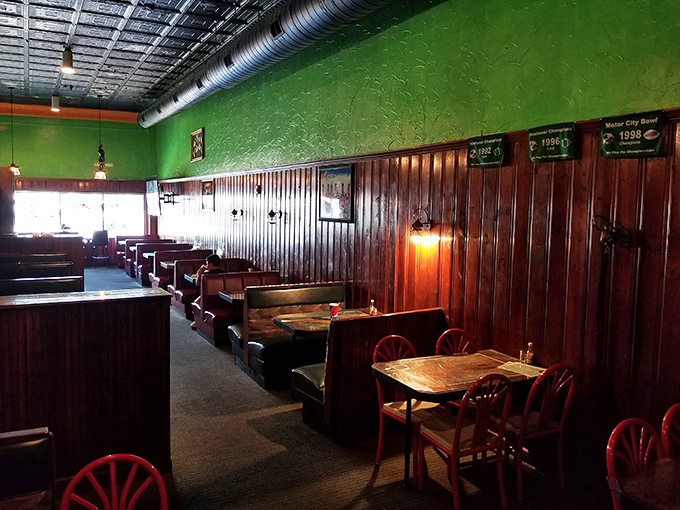 Cozy booths line the wall like old friends waiting for a chat, the warm wood and green walls creating the perfect backdrop for salsa-fueled conversations.
