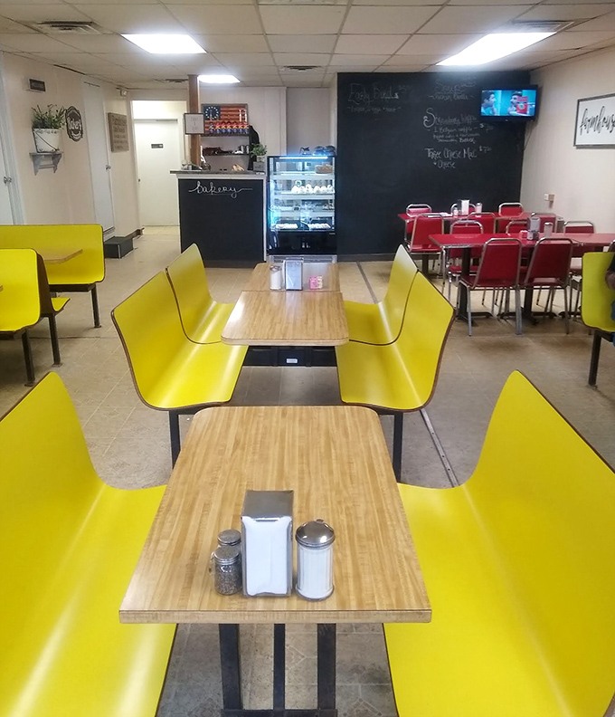 Bright yellow booths that say "sit awhile" in a dining room that feels like the breakfast version of a warm hug.