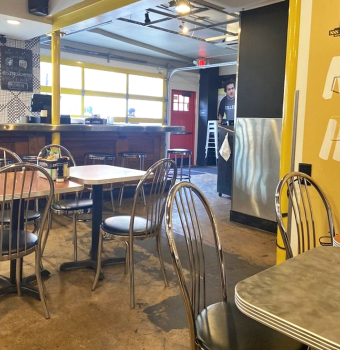 Yellow support beams and chrome chairs create that perfect balance of "hip enough to Instagram, comfortable enough to linger." Breakfast architecture at its finest.