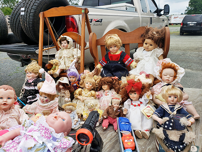Childhood nostalgia arranged in neat rows—each doll's vacant stare somehow both innocent and slightly unnerving in the Pennsylvania sunshine.