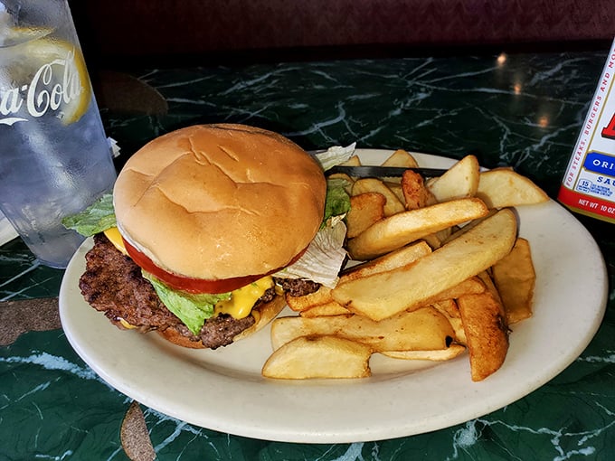 The burger that time forgot to complicate. Simple, honest, hand-formed patty with classic toppings and steak fries that mean business.