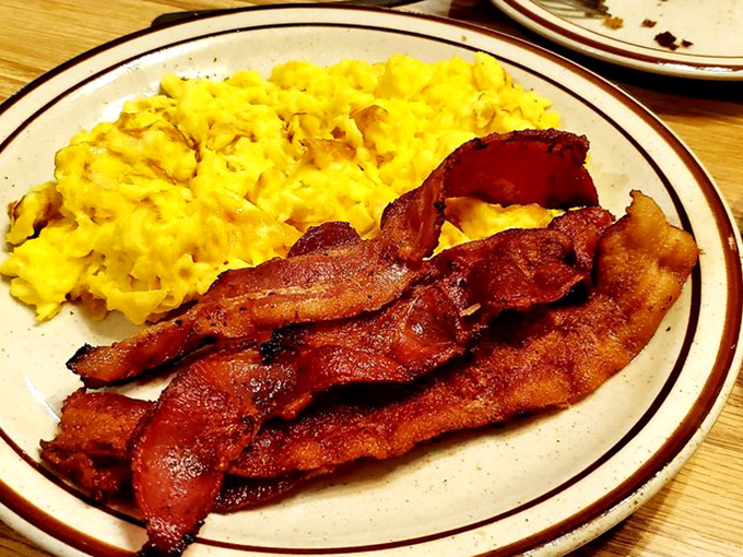 Those scrambled eggs look so fluffy they might float off the plate, while that bacon has achieved the perfect crisp-to-chew ratio.