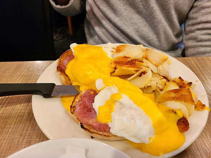 Eggs Benedict with hollandaise so vibrant it could guide ships to shore. This is why breakfast remains the undisputed champion of meals. 