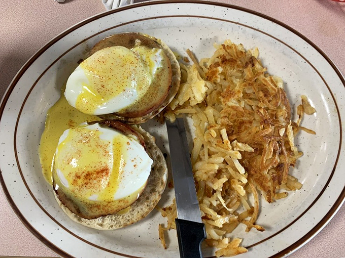 Eggs Benedict done right&mdash;those perfectly poached eggs look like they're wearing little hollandaise jackets for a fancy breakfast party.