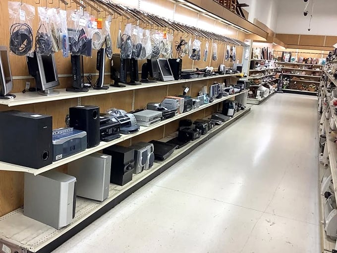 Electronic archaeology at its finest &ndash; each shelf a time capsule of technological evolution from boomboxes to DVD players.