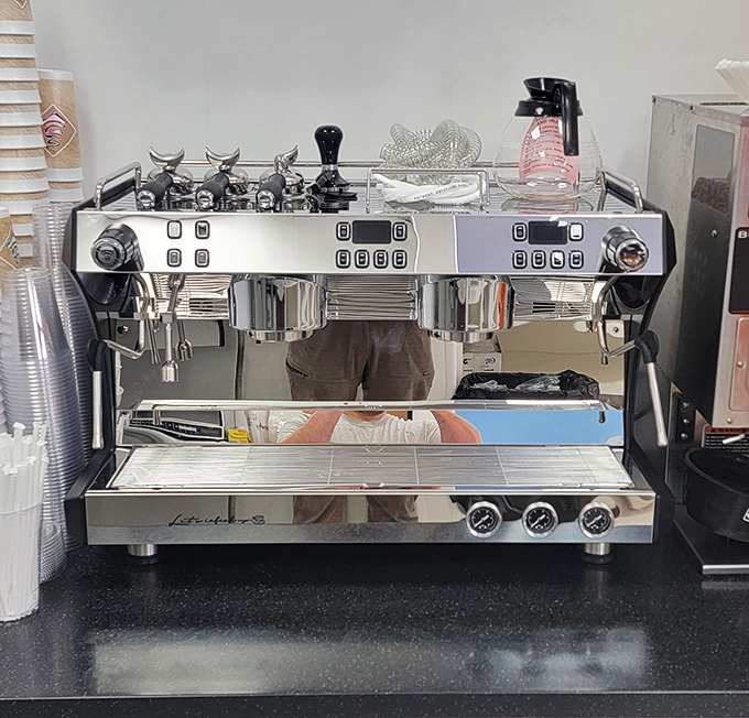 This isn't just an espresso machine—it's a gleaming silver alchemist, transforming humble beans into liquid motivation one perfect shot at a time.
